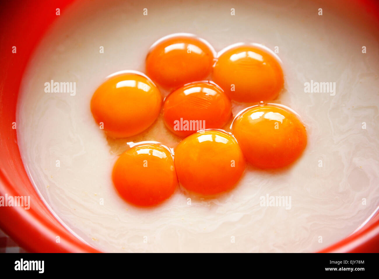 Egg yolk closeup as a background. Raw eggs in a bowl Stock Photo - Alamy