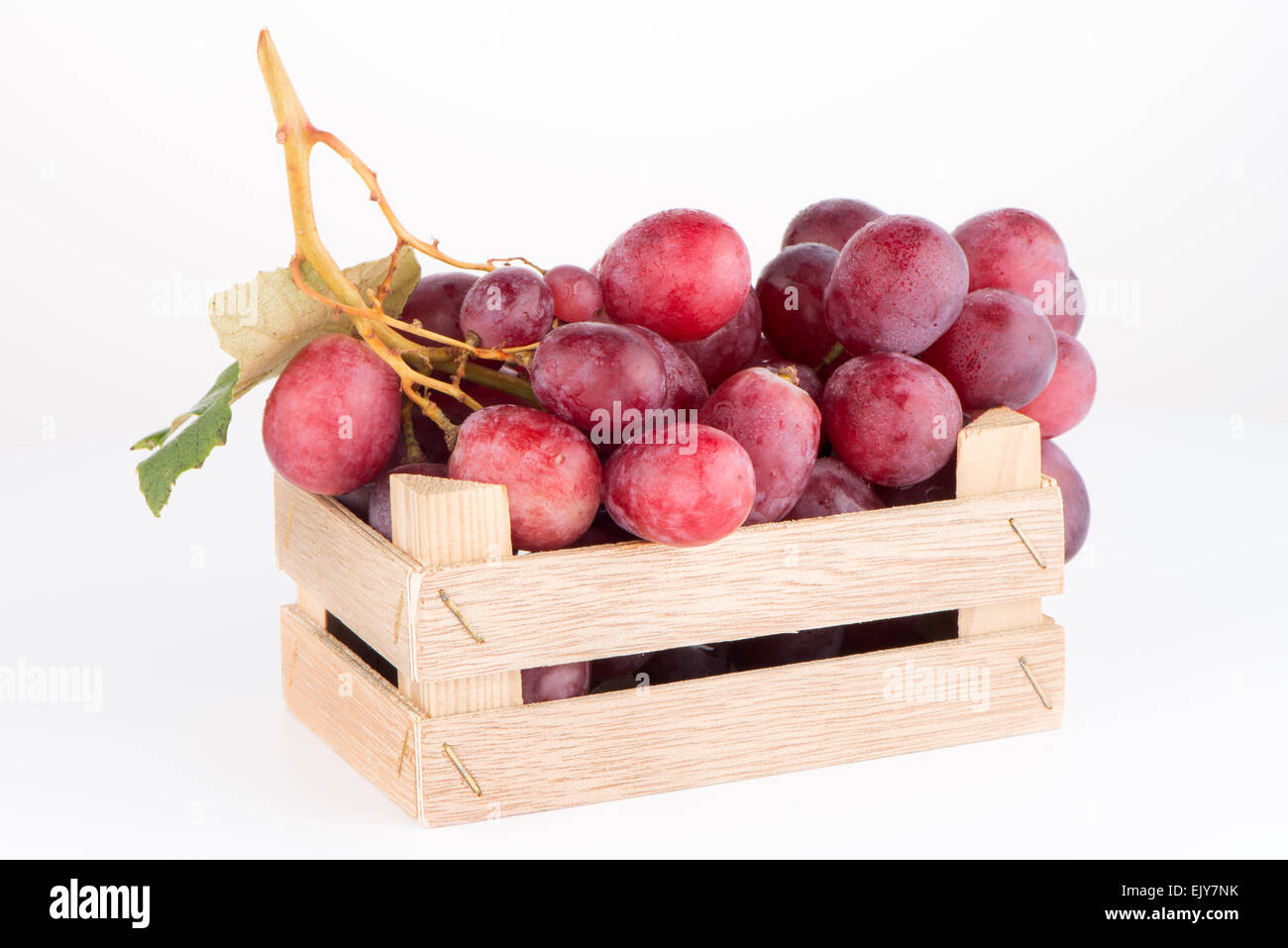 Bunch of red grapes , fresh with water drops. Isolated on white ...