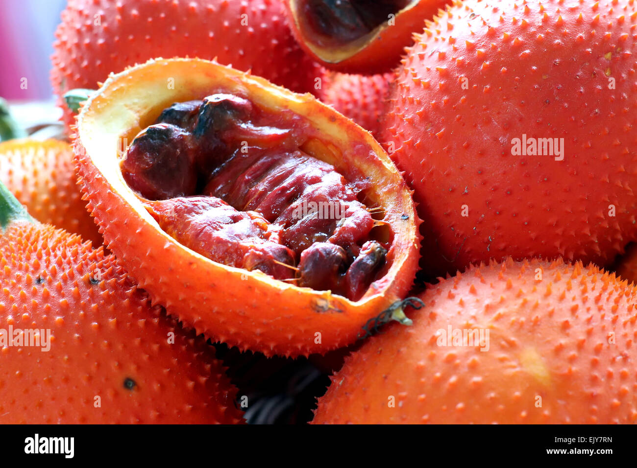 Gac fruit at fruit market Stock Photo - Alamy