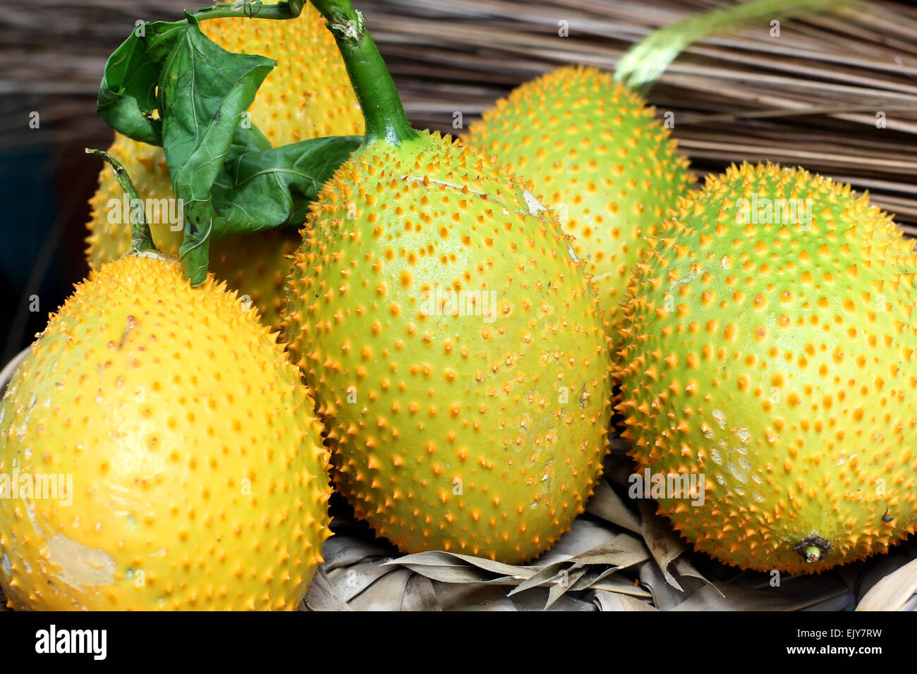 Gac fruit at fruit market Stock Photo - Alamy