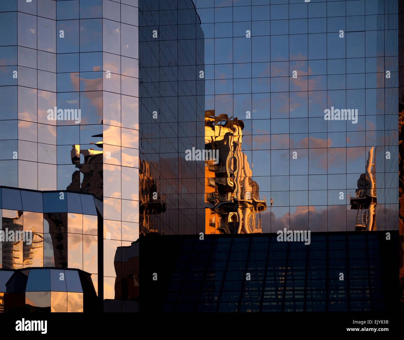 Evening sunlight reflected in the Quay West building, Salford Quays ...