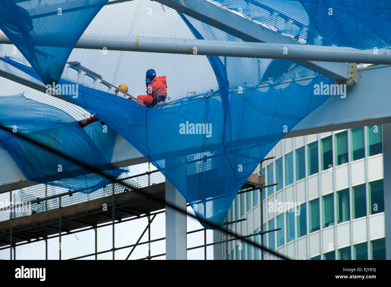 Workman installing ETFE panels on the new roof at Victoria Station ...