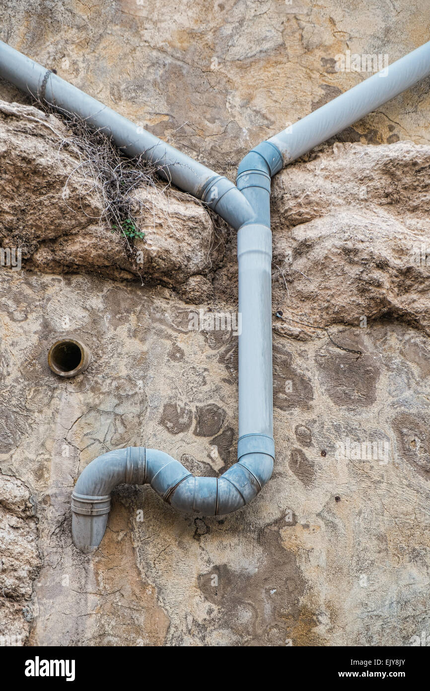 Sewage pipes running down an exterior wall Stock Photo - Alamy