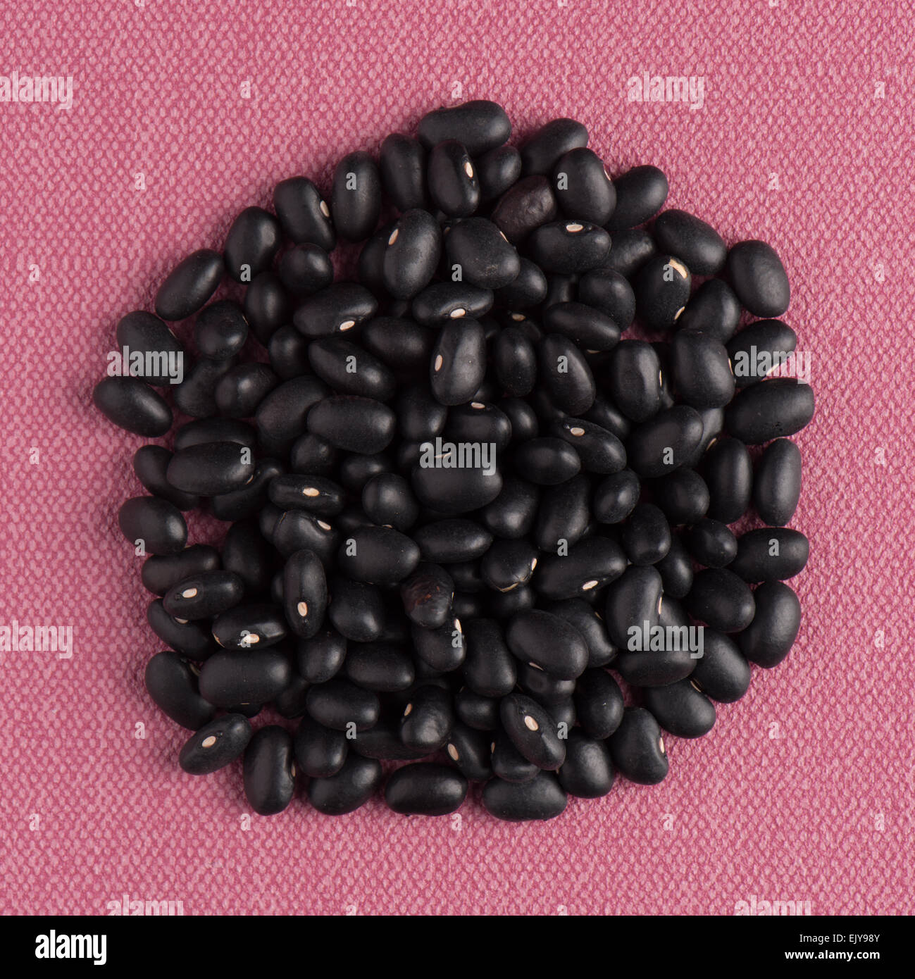 Circle of pink beans on brown background Stock Photo - Alamy