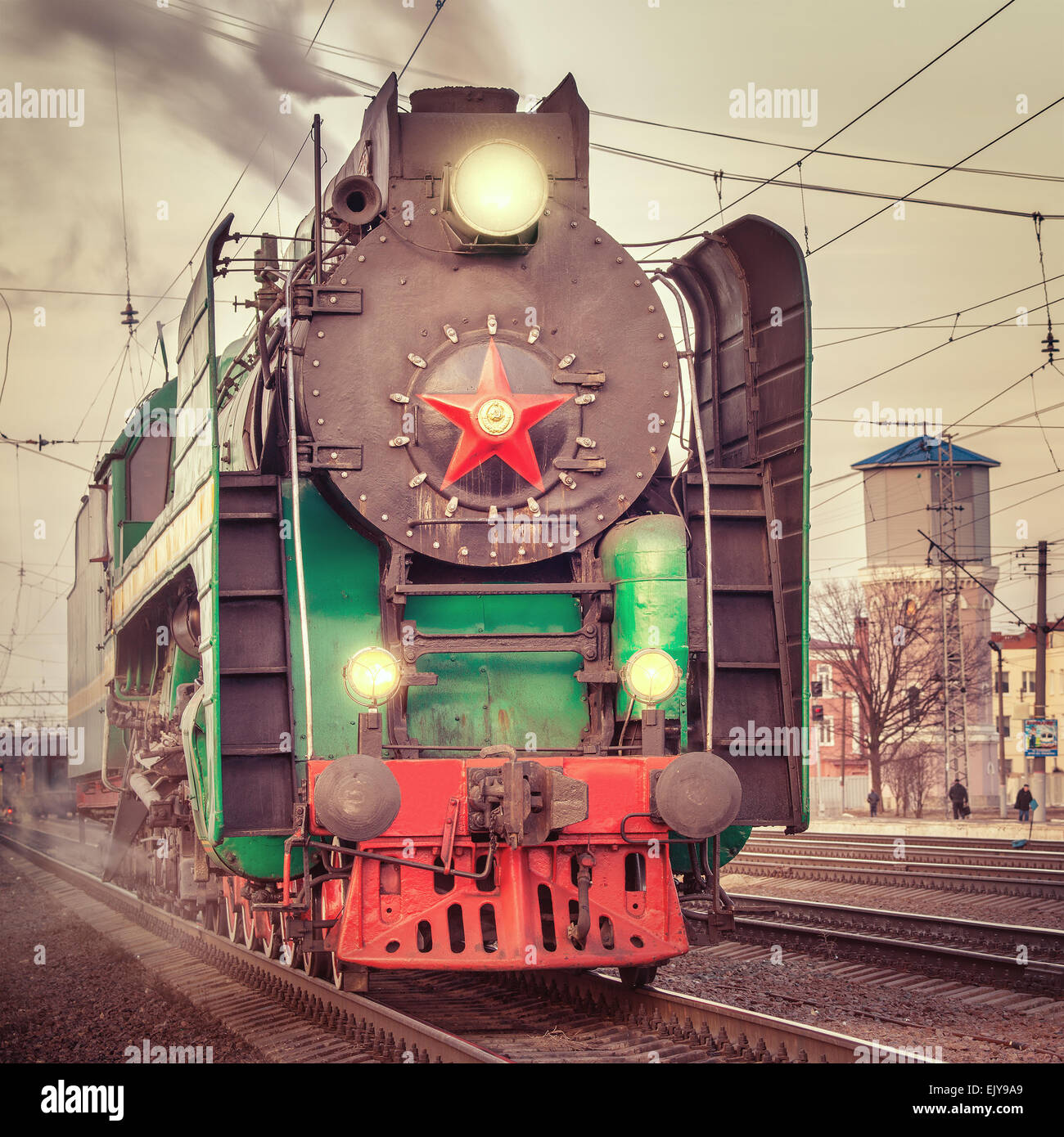 Retro steam train stands on the station at sunset time Stock Photo - Alamy