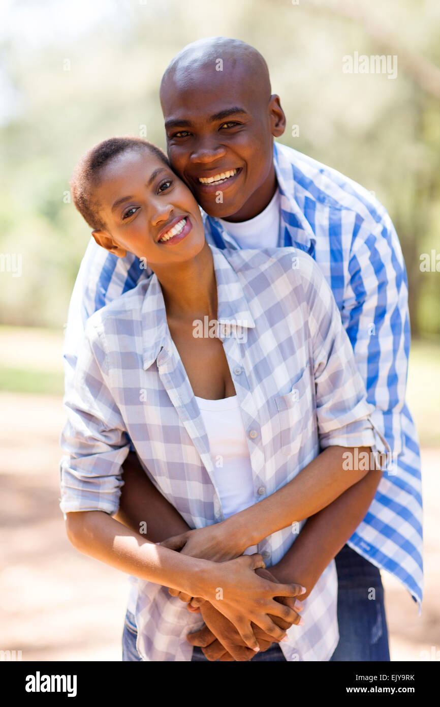 beautiful young African couple embracing outdoors Stock Photo - Alamy