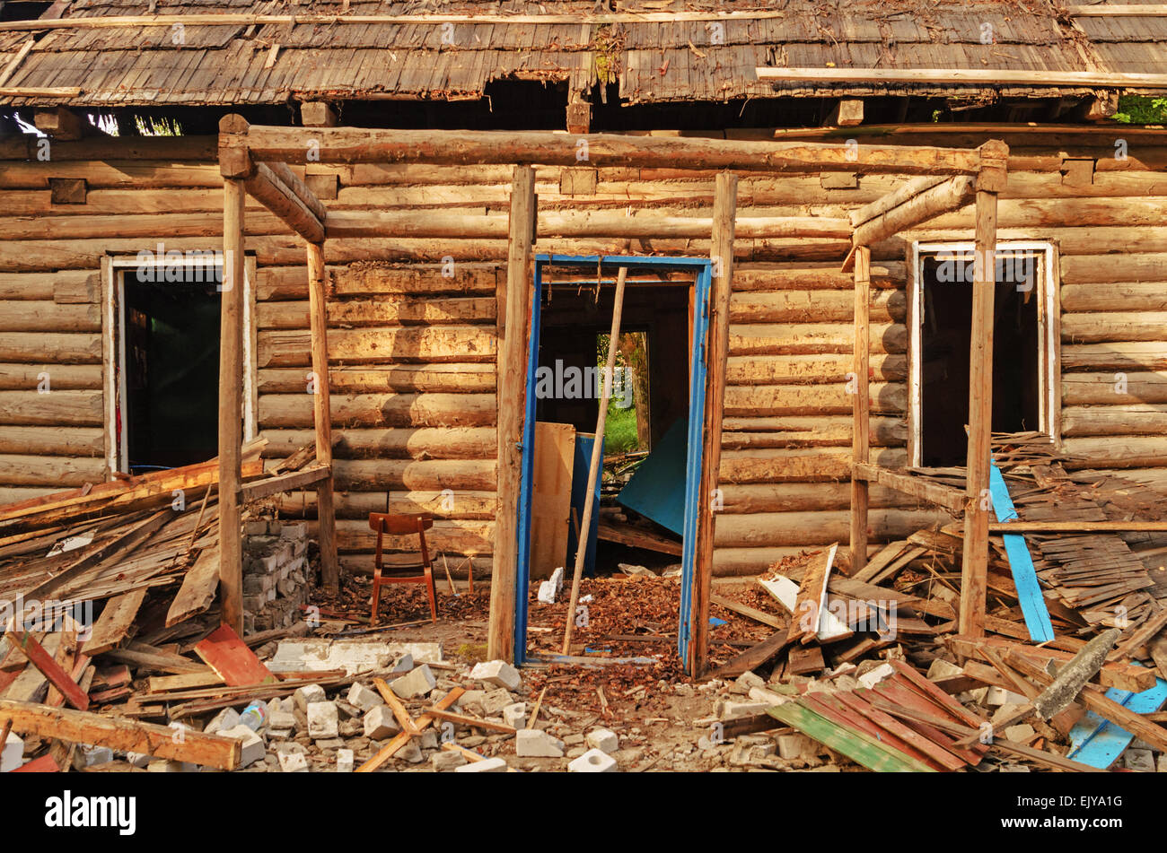 Abandoned disassembling rural house Stock Photo - Alamy