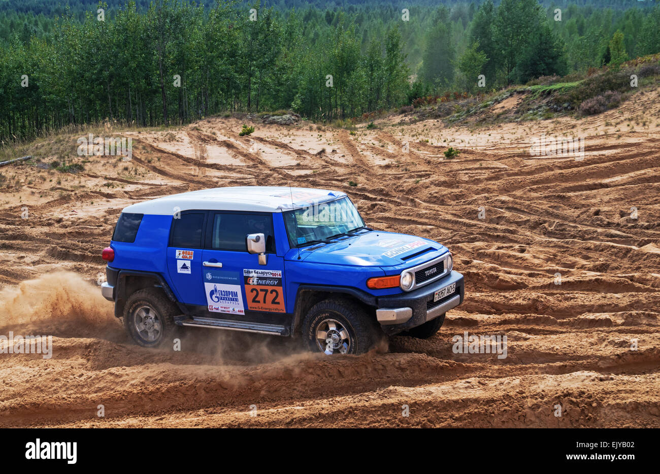 Races on a rally-raid on sandy dunes. Rally-raid Baha "Belarus" 2014 ...