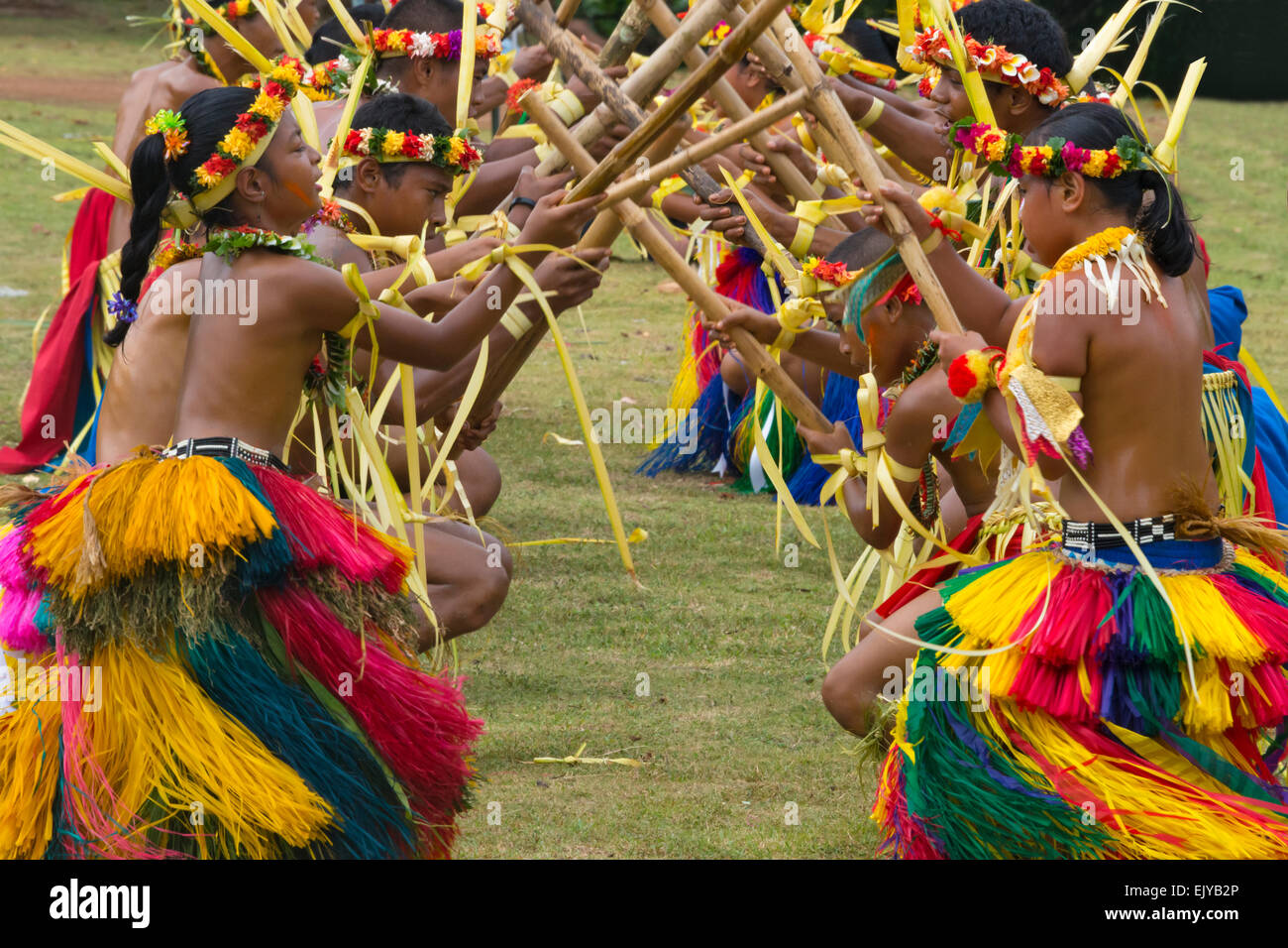Yapese girls in traditional clothing dancing with bamboo pole at Yap ...