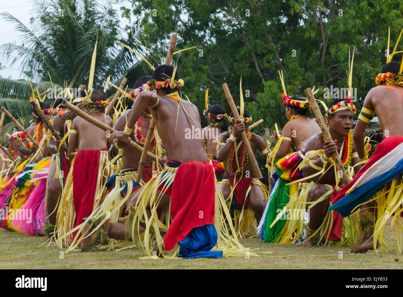 Boys and girls in traditional clothing dancing with bamboo pole at Yap ...