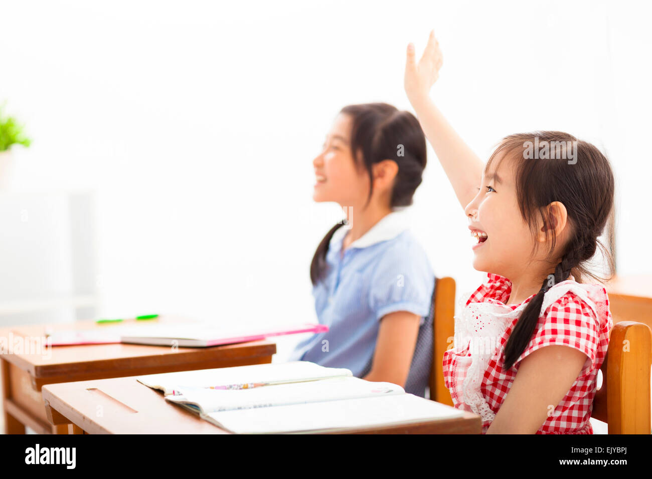 Classroom hands raising children group hi-res stock photography and ...