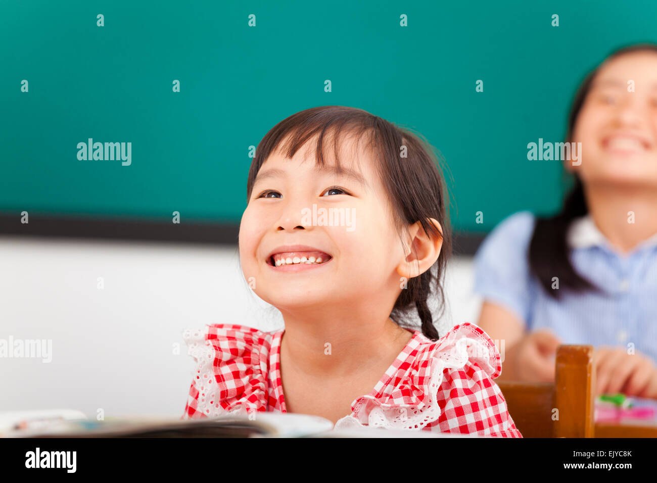happy little girls in the classroom Stock Photo - Alamy