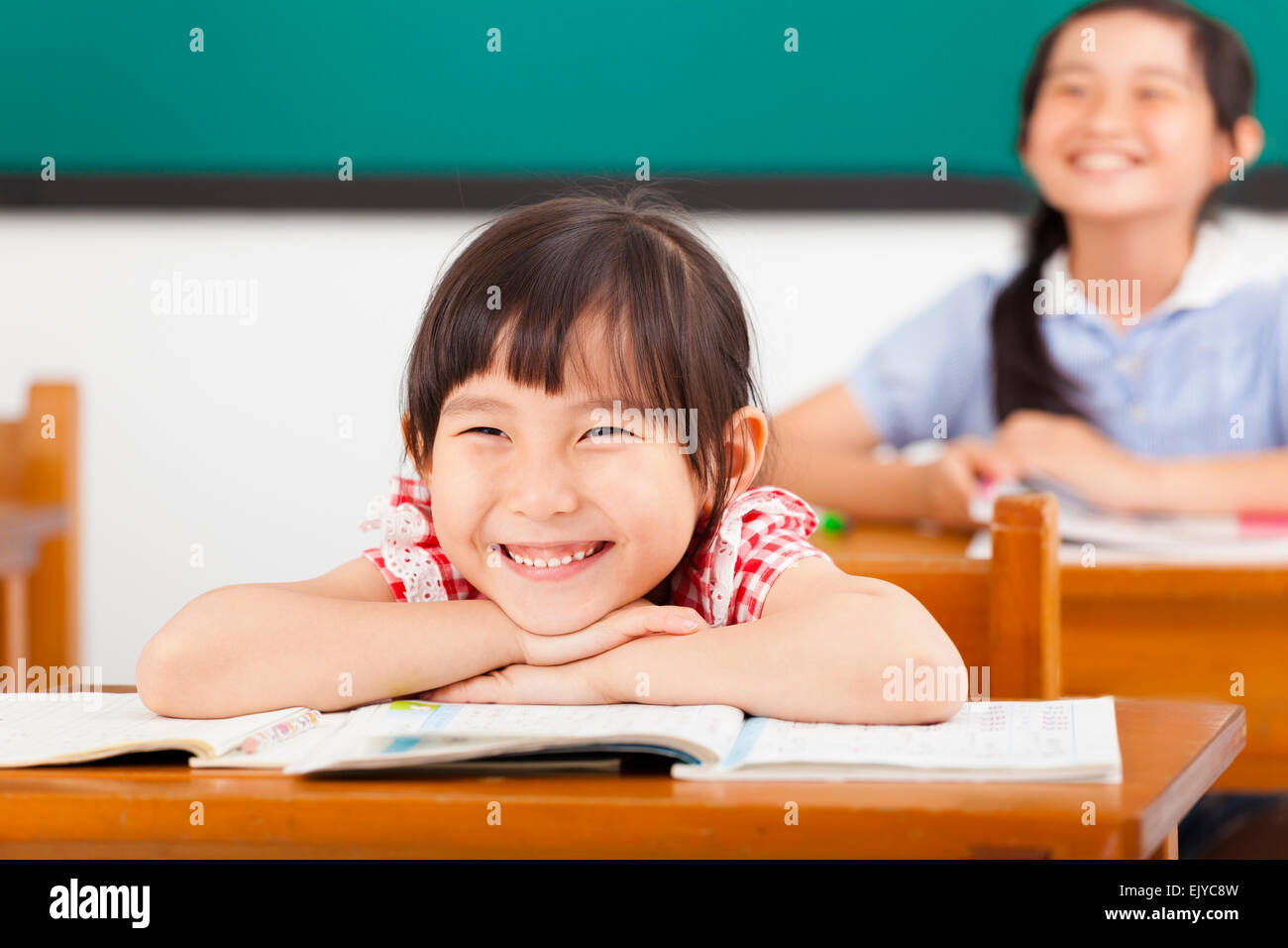 happy little girls in the classroom Stock Photo - Alamy