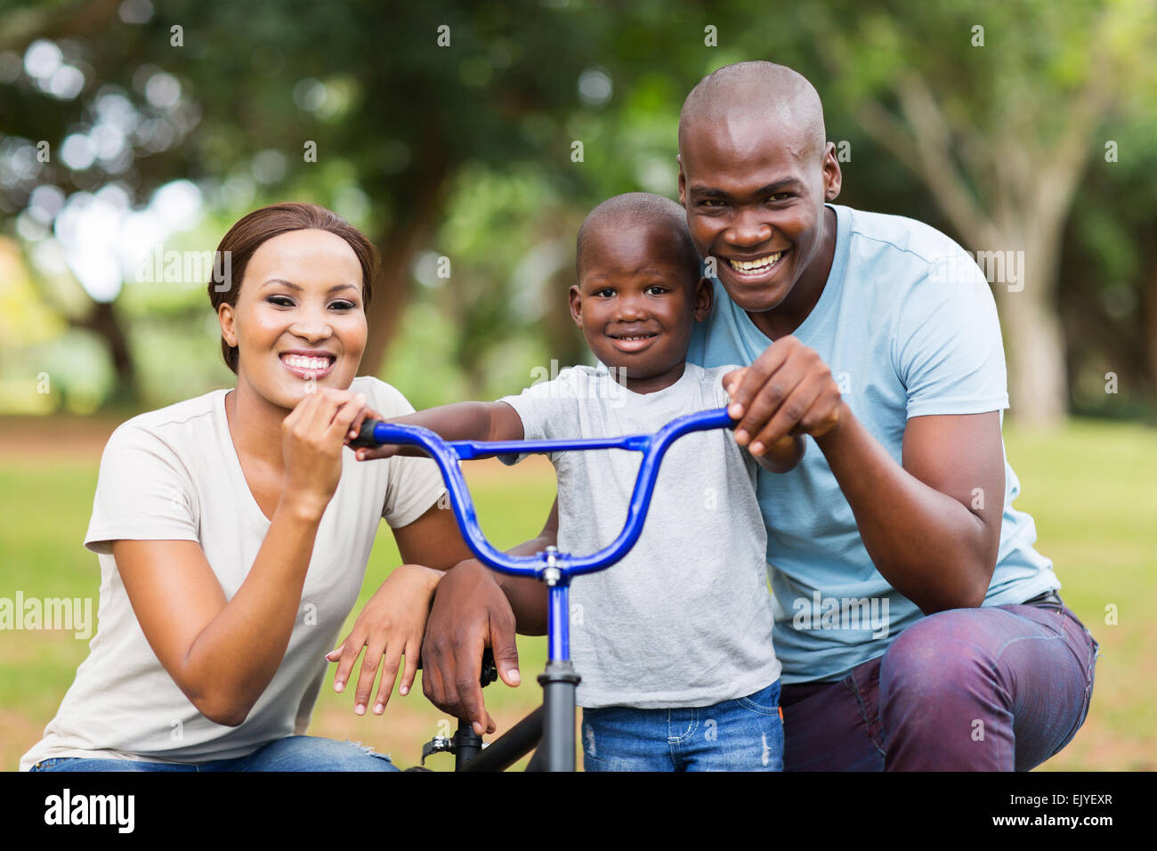 adorable afro American family having fun together outdoors Stock Photo ...