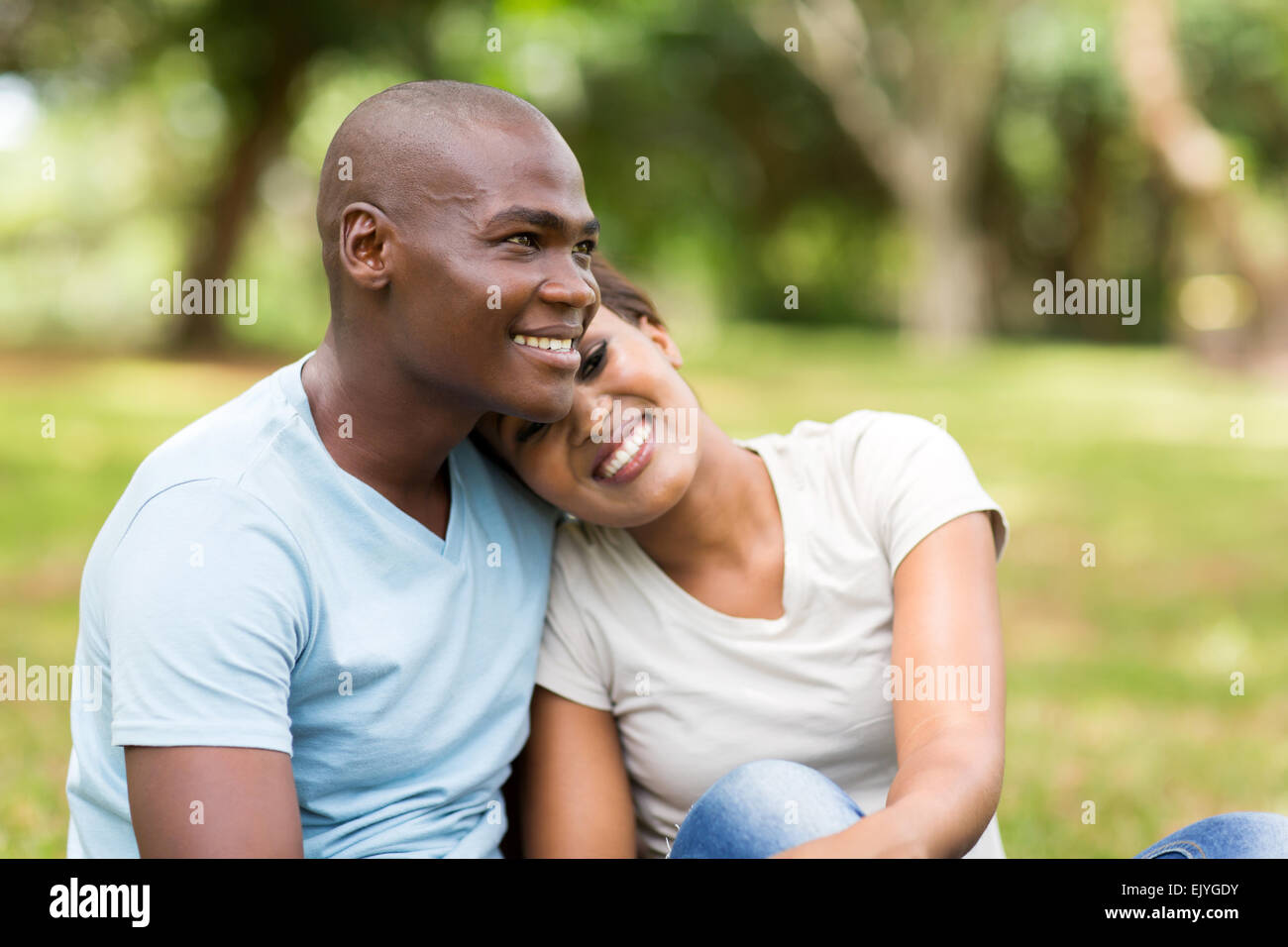 beautiful young African American couple sitting outdoors Stock Photo ...