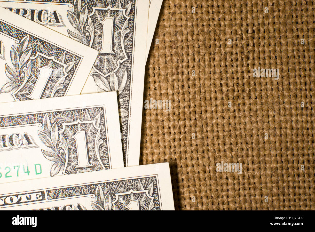Banknotes US $1 dollars on the old sacking Stock Photo - Alamy