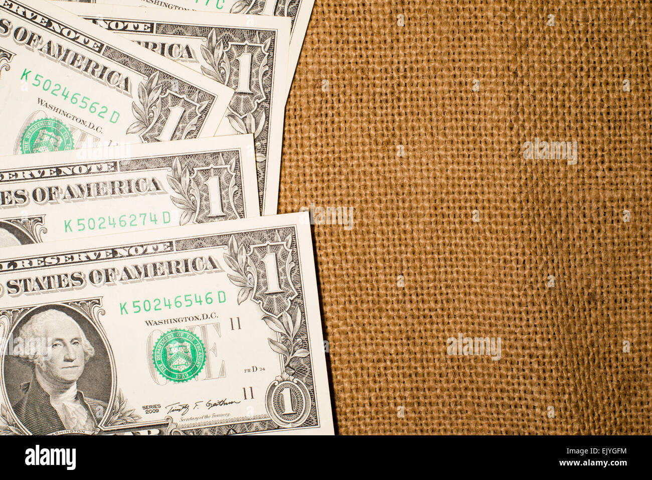 Banknotes $1 US dollars on the old sacking Stock Photo - Alamy