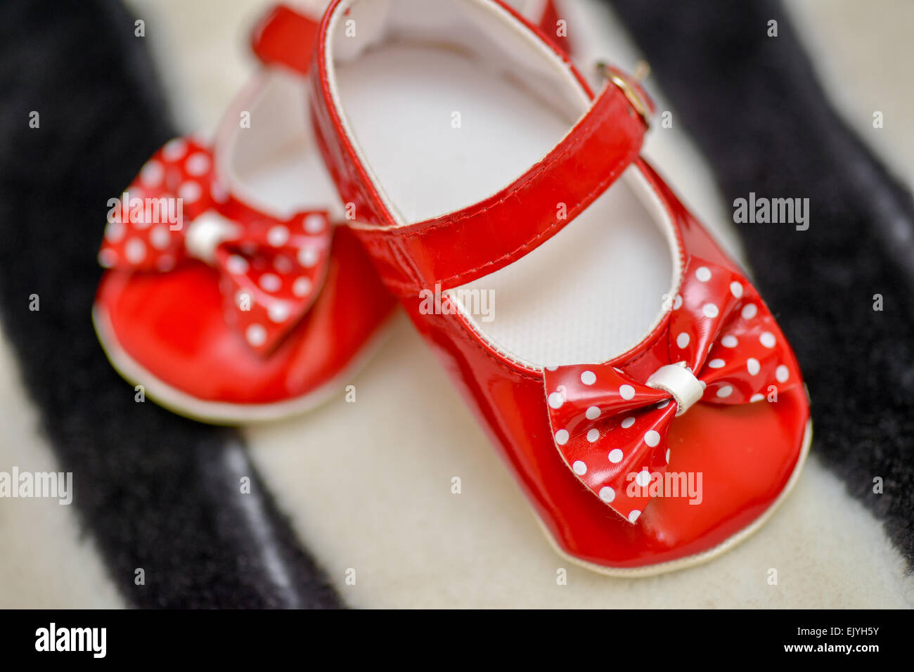 Red shoes baby girl with bow Stock Photo - Alamy