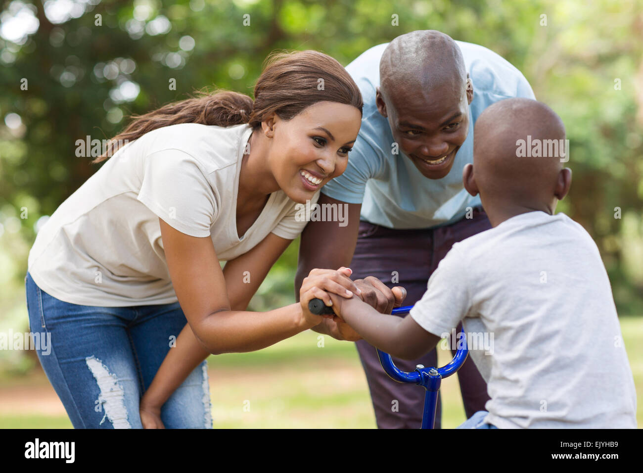 cheerful African family having fun together at park Stock Photo - Alamy