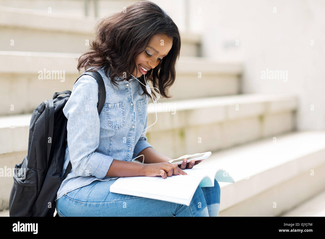pretty young afro American college girl reading on campus Stock Photo ...