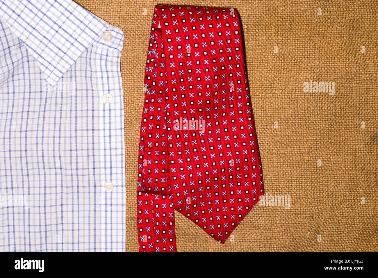 Red tie and plaid shirt on the old sacking Stock Photo - Alamy