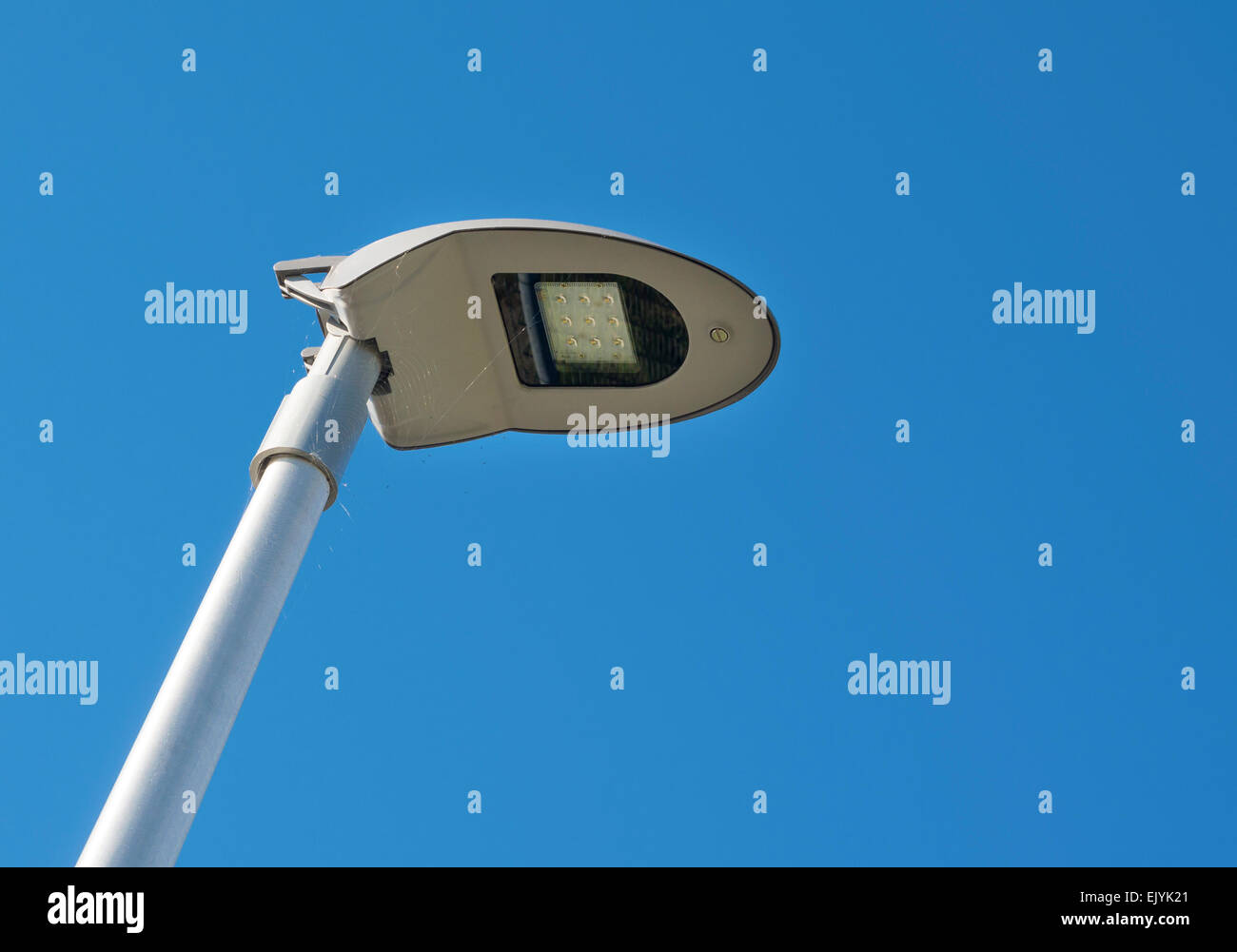 modern LED street lamp post against a blue sky Stock Photo - Alamy