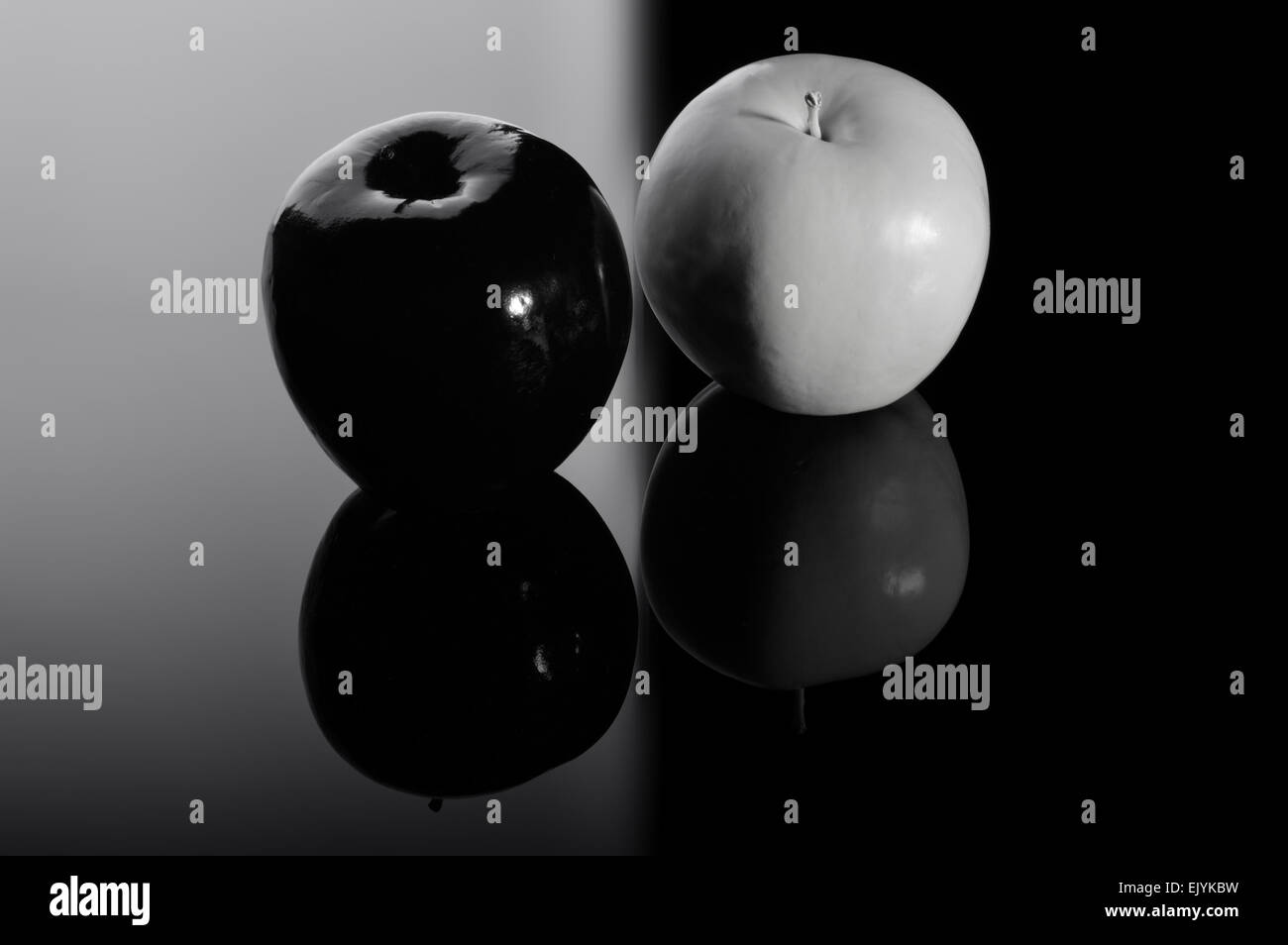 Black apple and white apple Stock Photo - Alamy