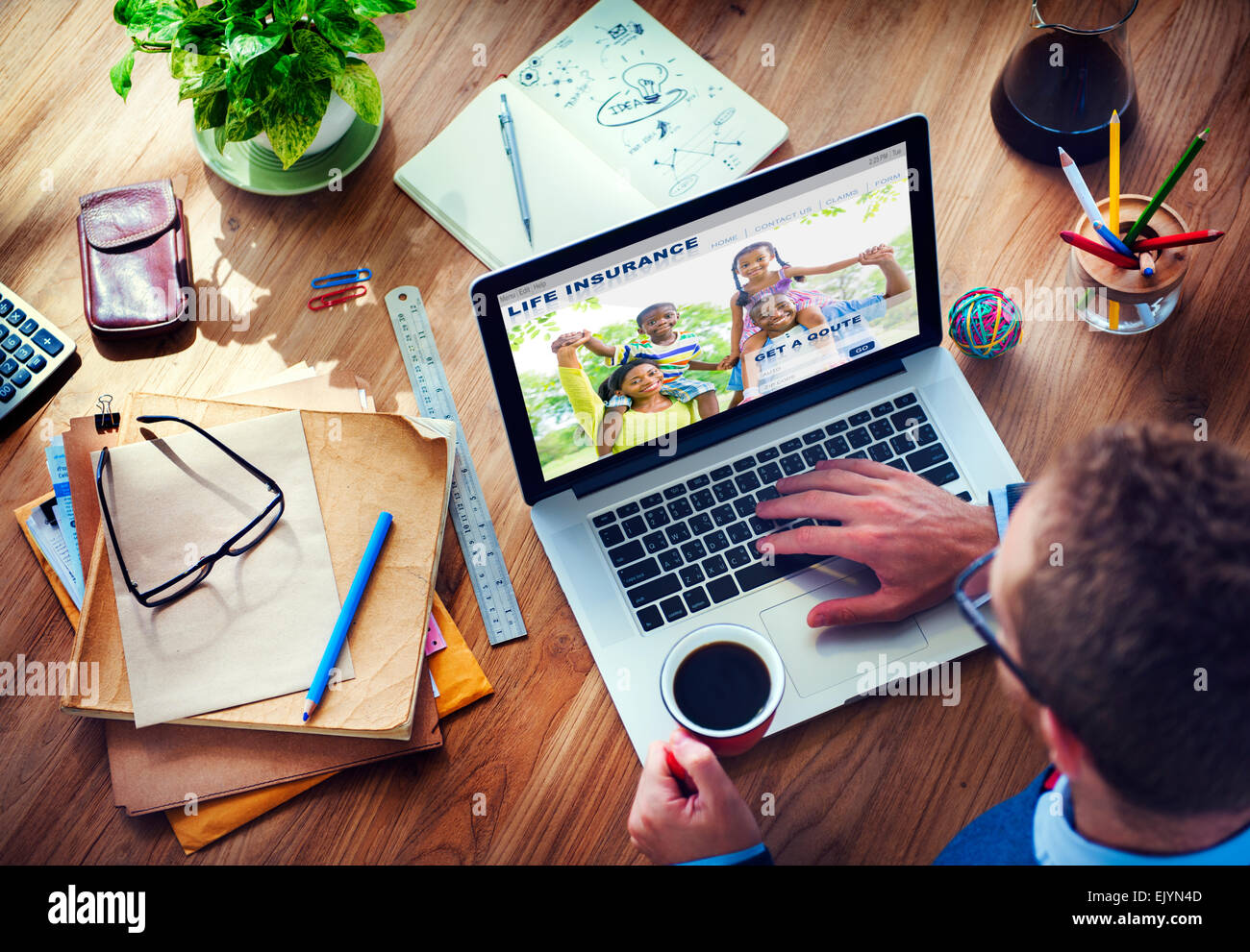 Man Working with Computer Life Insurance Stock Photo - Alamy