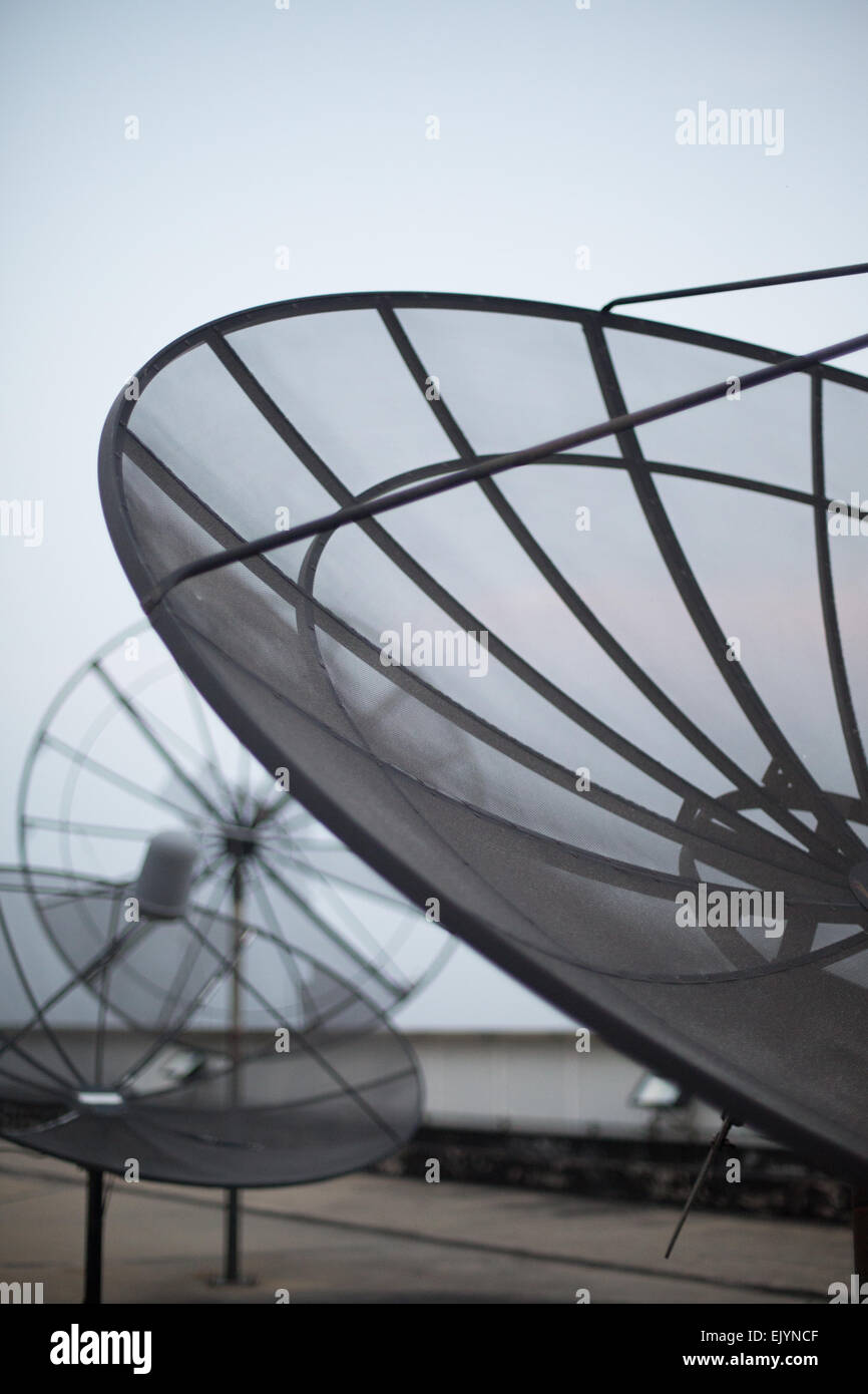 Satellite communications dishes on roof hi-res stock photography and ...