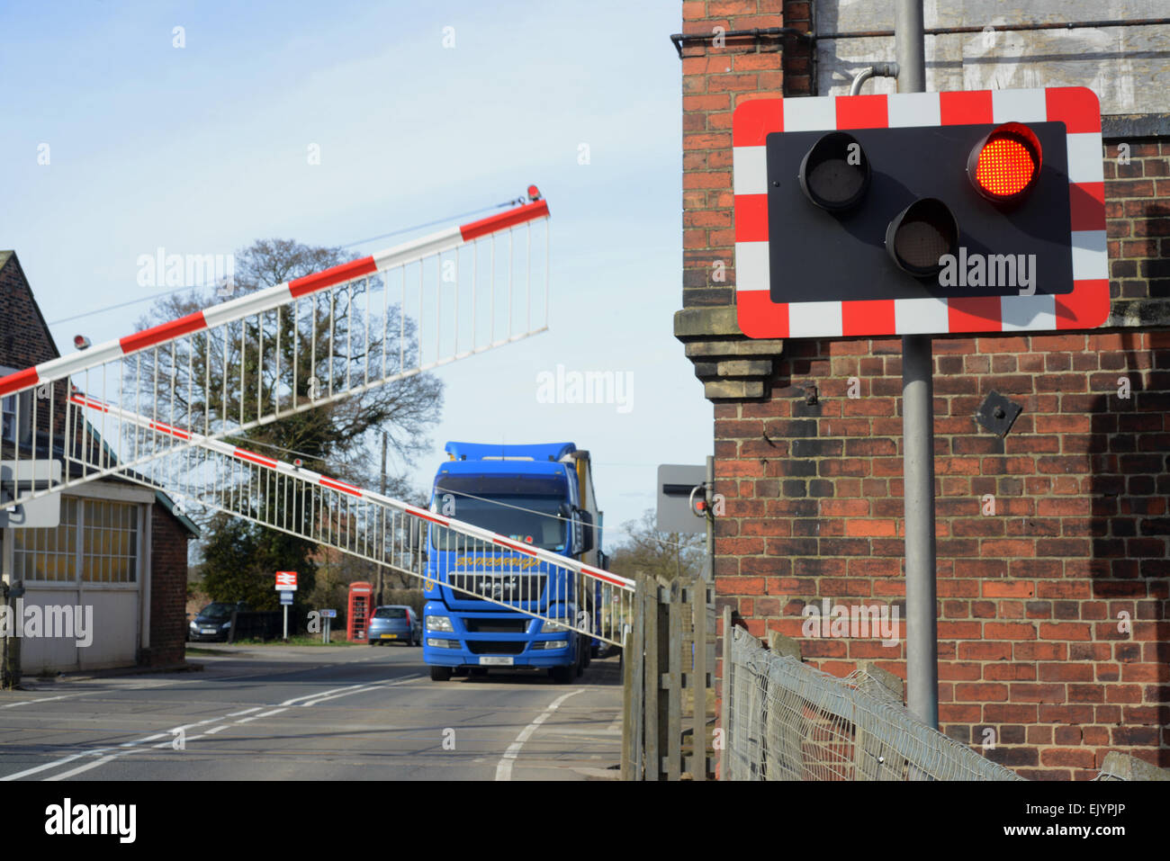 lorry driver waiting as barriers open at Howden station level crossing ...