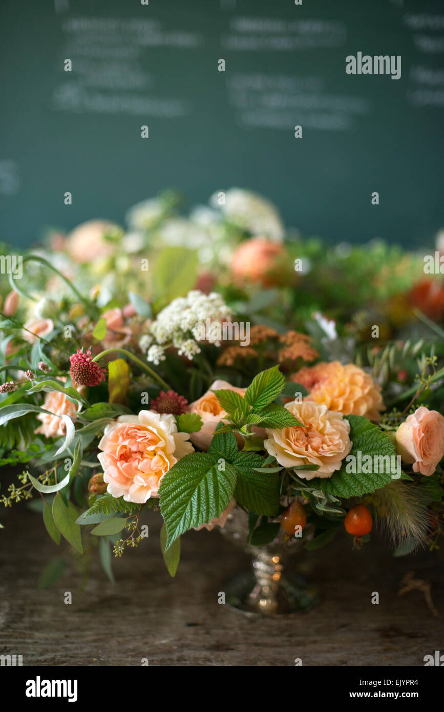 Formal floral arrangement of roses in silver urn Stock Photo - Alamy