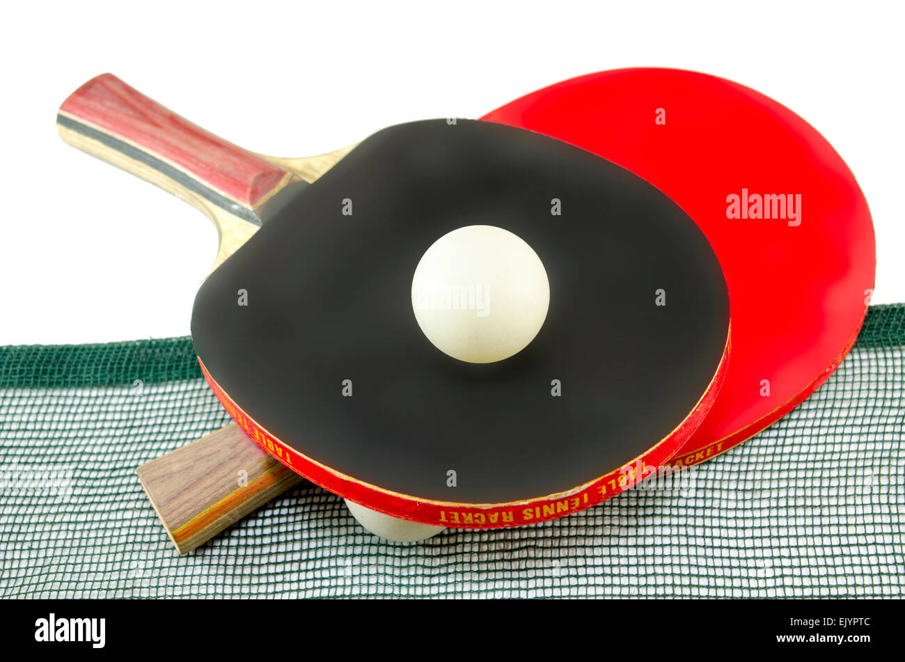 Two table tennis rackets one on top of the other and an old net ...