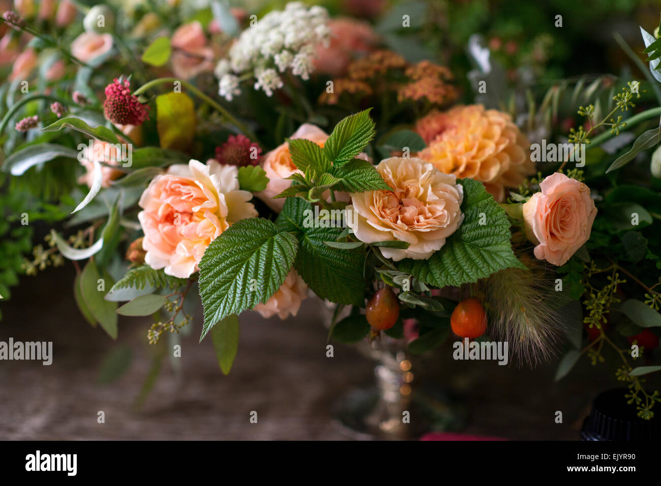Formal floral arrangement of roses in silver urn Stock Photo - Alamy