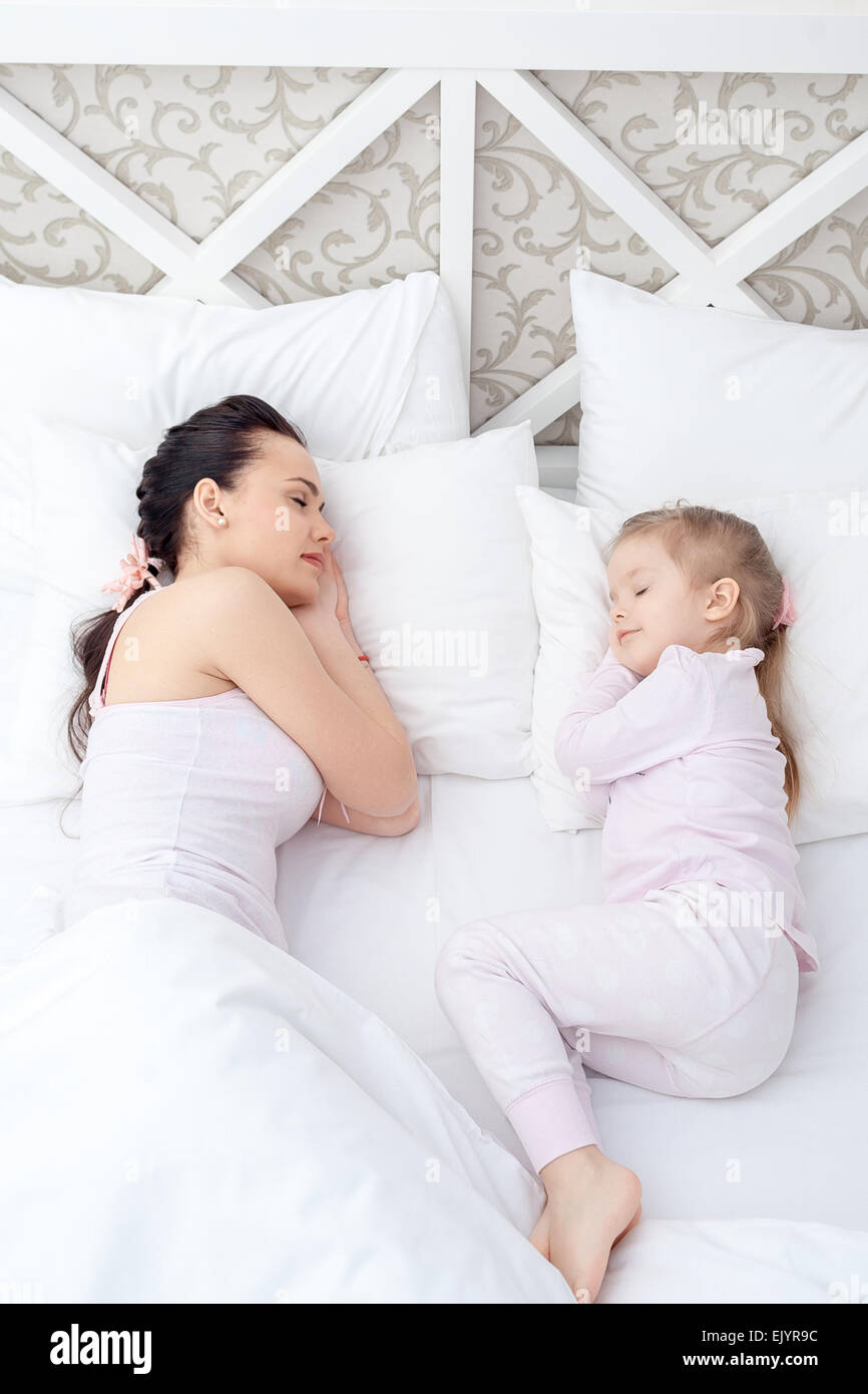Mother and daughter in bed Stock Photo - Alamy