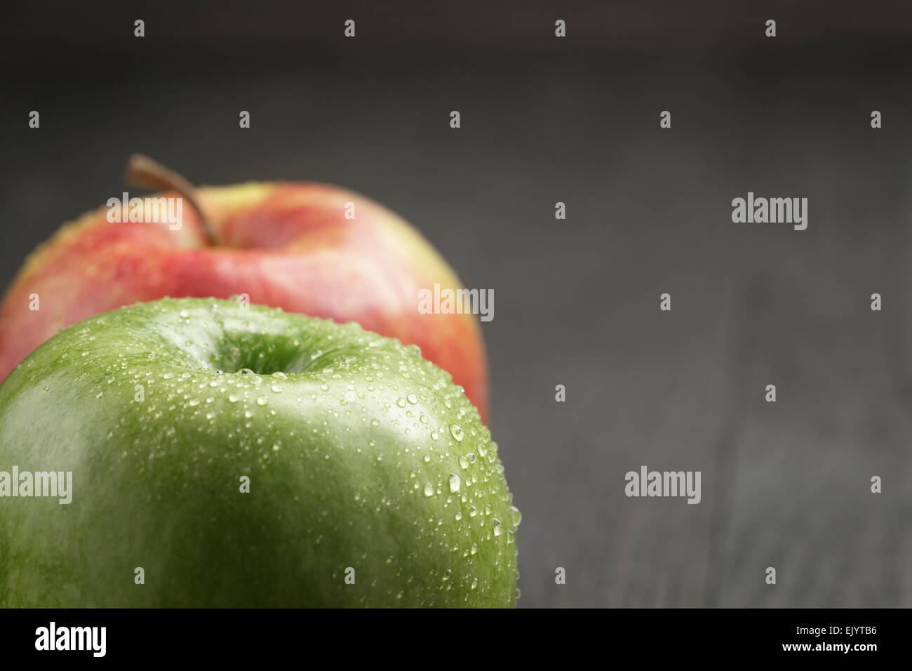 two ripe apples on wood table Stock Photo - Alamy