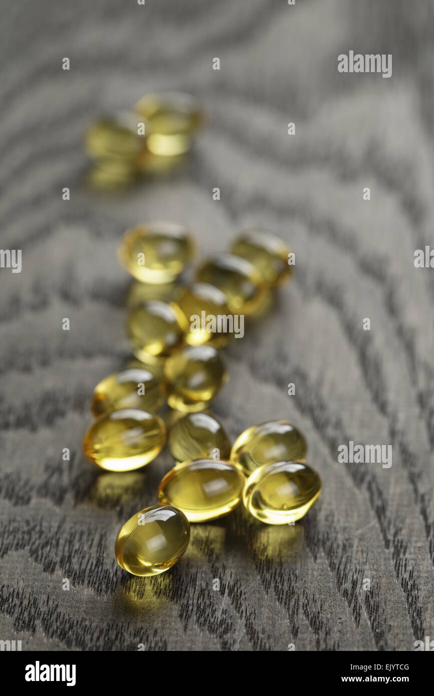 Golden oil capsules hi-res stock photography and images - Alamy