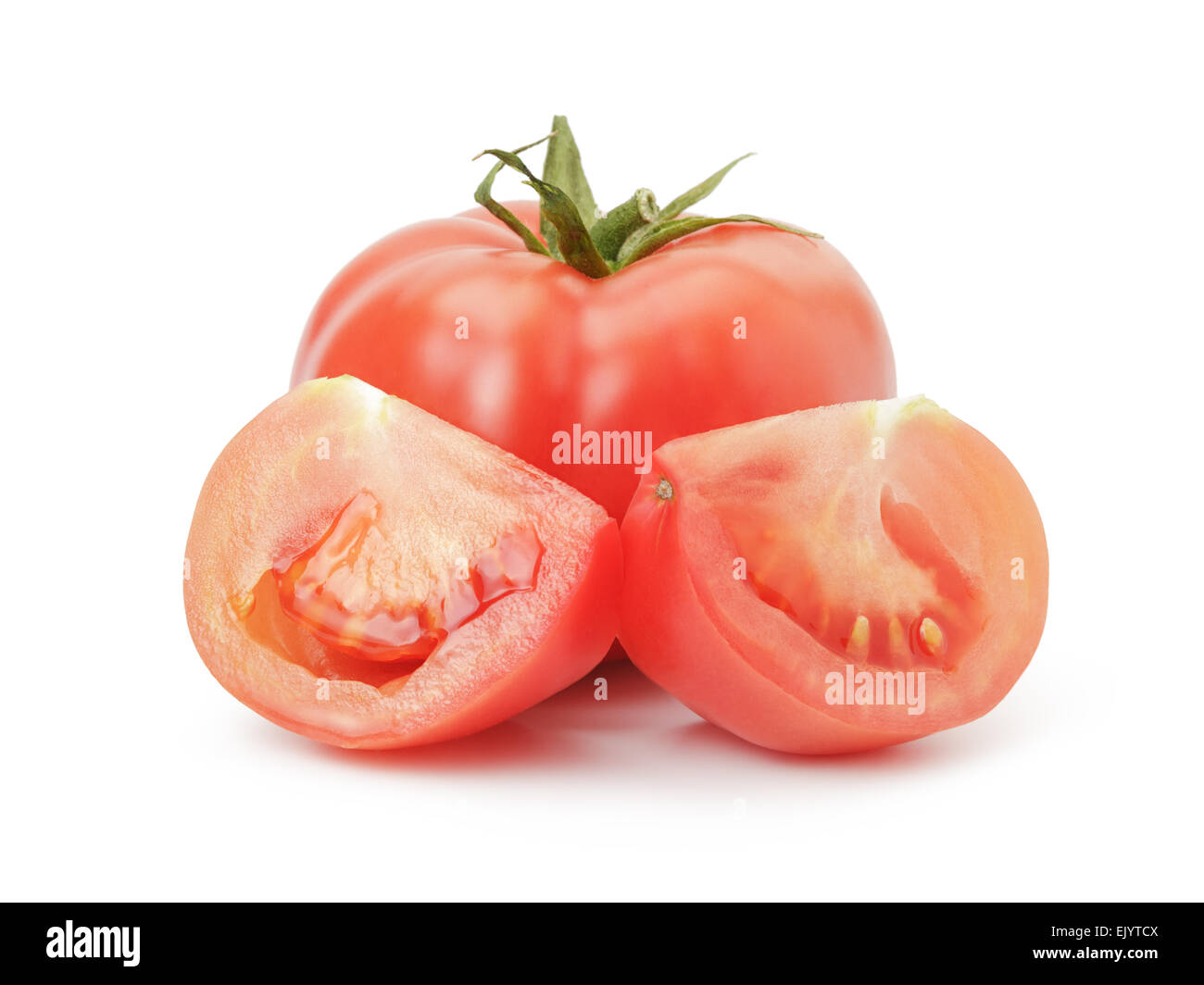 one ripe red tomato with segments isolated on white Stock Photo - Alamy