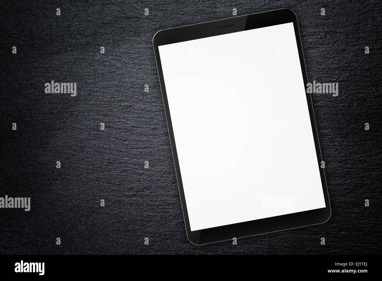 generic tablet pc on top of slate board Stock Photo - Alamy