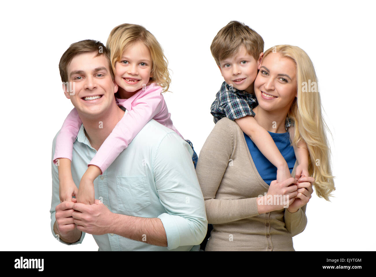Smiling children riding piggyback on parents Stock Photo - Alamy