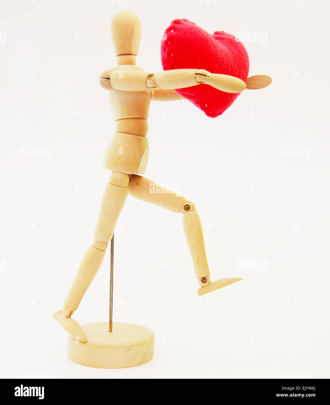 Human wooden figure with Handmade Heart model made from velvet Stock ...