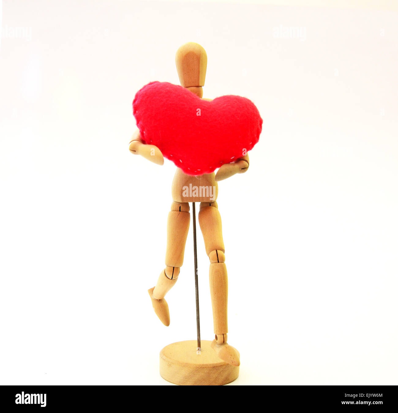 Human wooden figure with Handmade Heart model made from velvet Stock ...