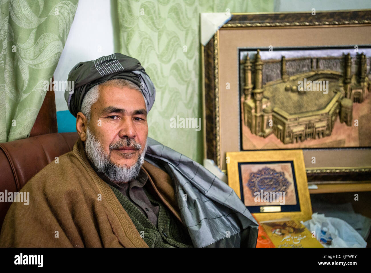 Atiqullah Ansari, Imam of Shrine of Ali Mosque, sitting at his cabinet ...