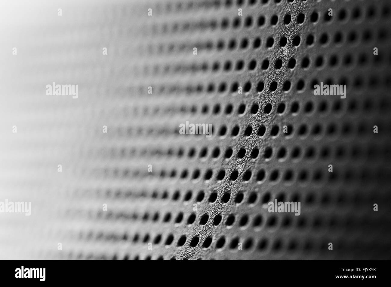 Row of holes in an electrical appliance Stock Photo - Alamy