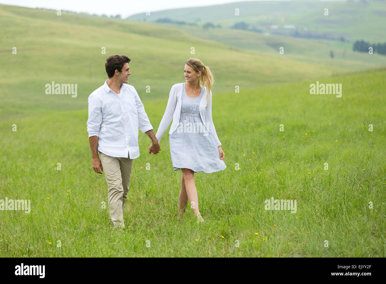 lovely couple walking on countryside Stock Photo - Alamy