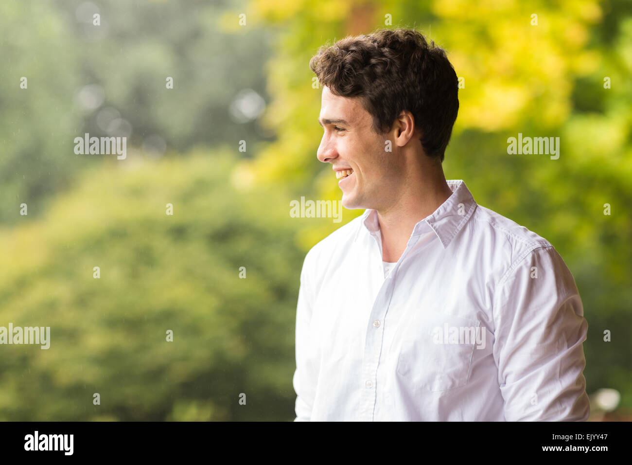 cheerful young man standing outdoors Stock Photo - Alamy
