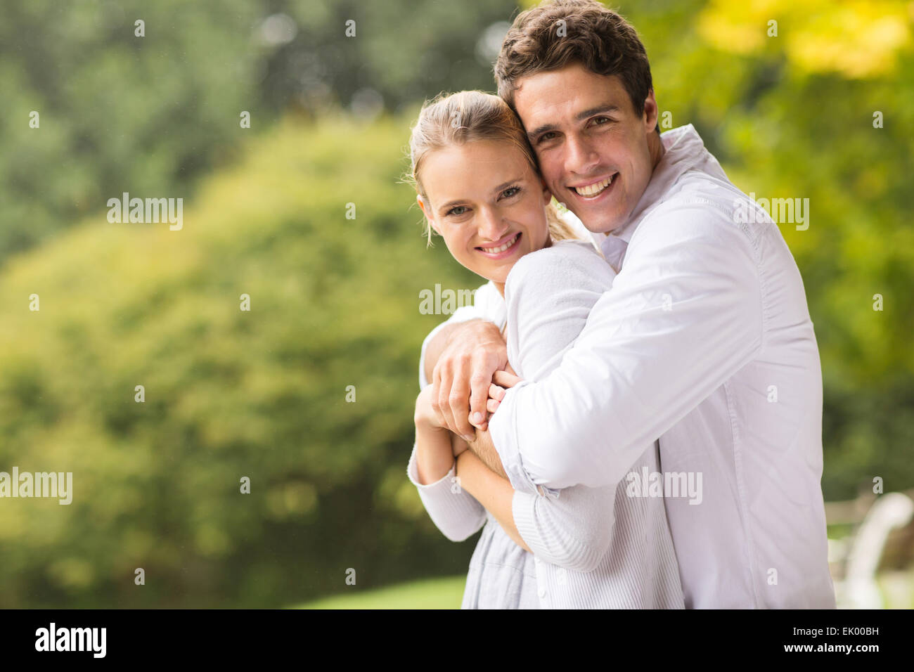 portrait of cute young couple hugging outdoors Stock Photo - Alamy