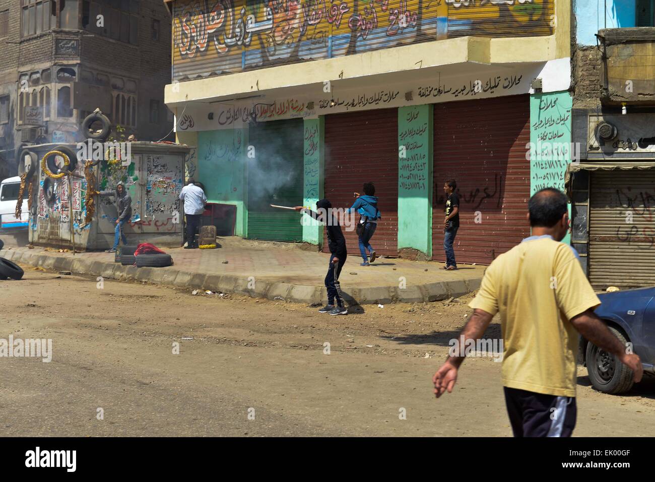 Cairo, Egypt. 3rd Apr, 2015. An Egyptian boy shots flares towards riot ...