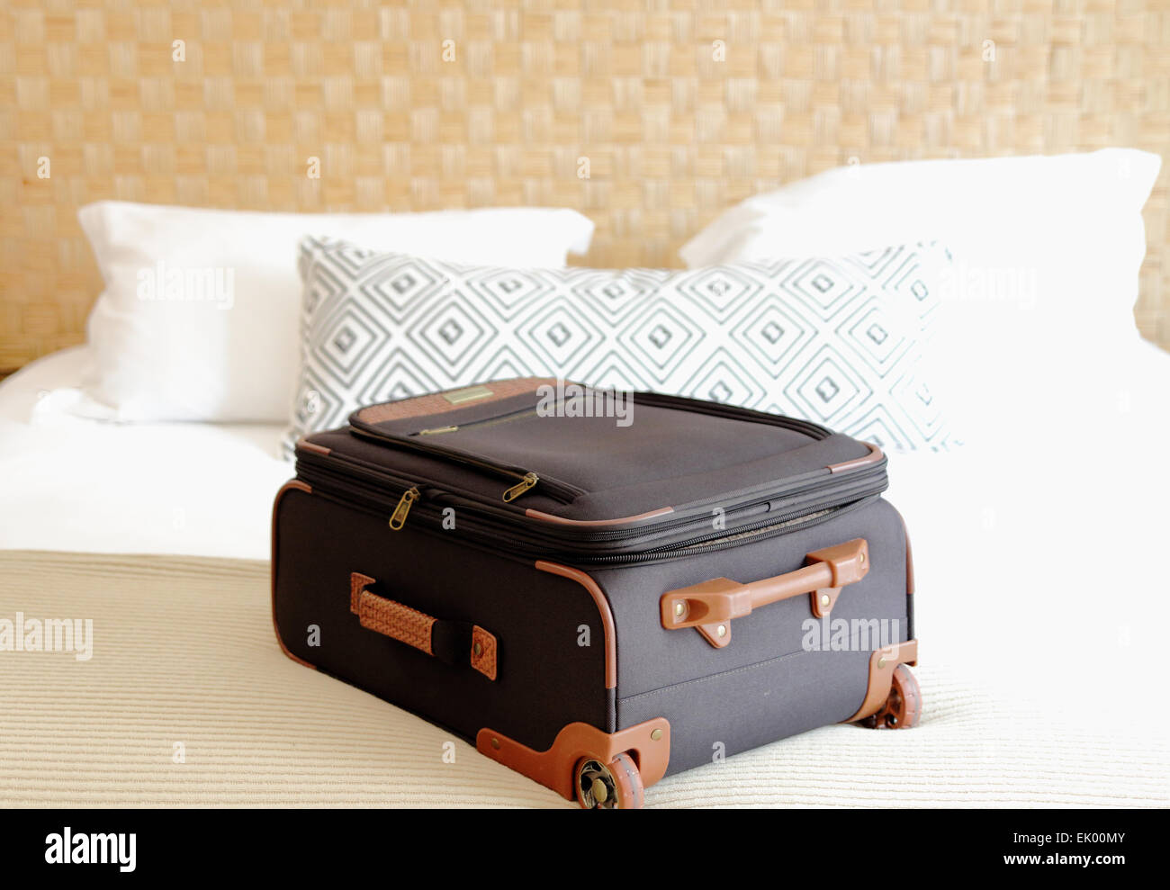 Suitcase on bed inside hotel hi-res stock photography and images - Alamy