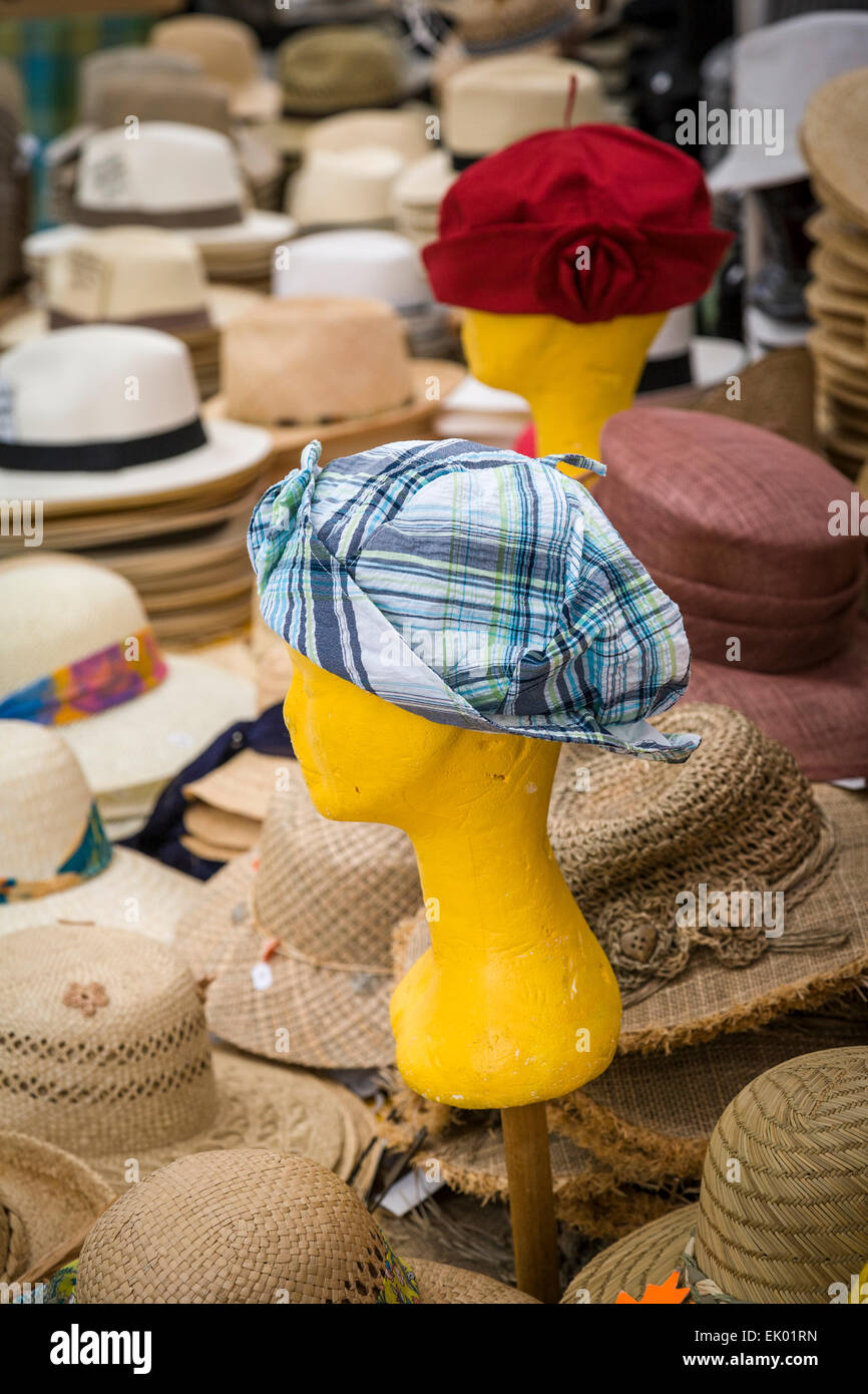 Hats on display for sale on a market stall in Eymet, France Stock Photo ...