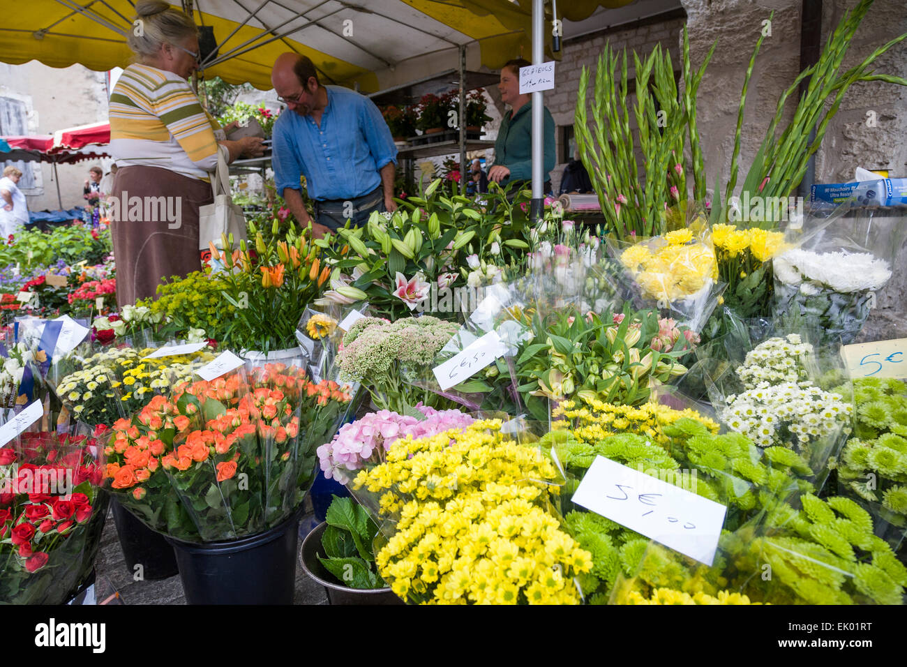 Flowers on display for sale on a market stall in Eymet, France Stock ...